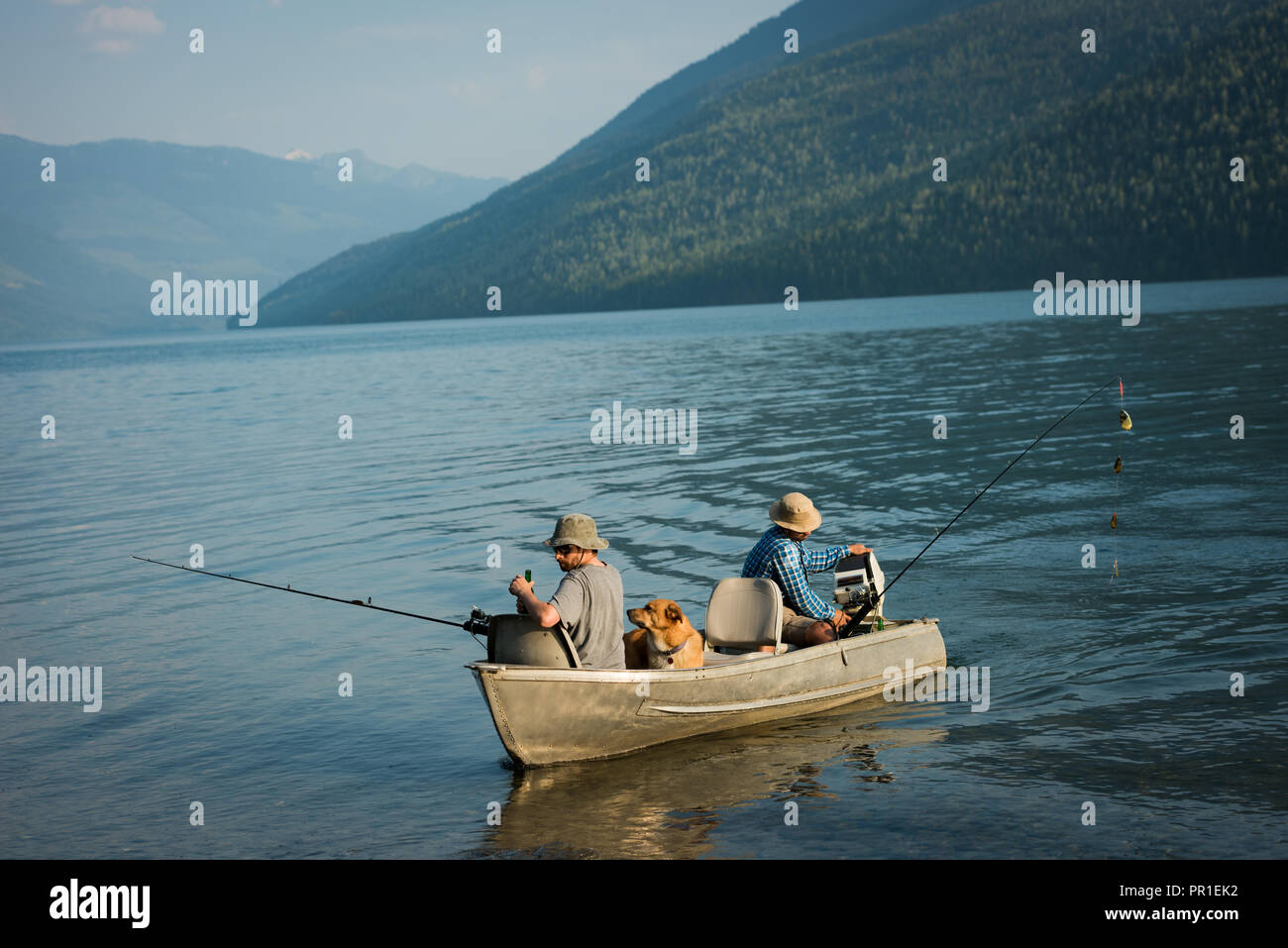 Two fishermen fishing in the river Stock Photo - Alamy