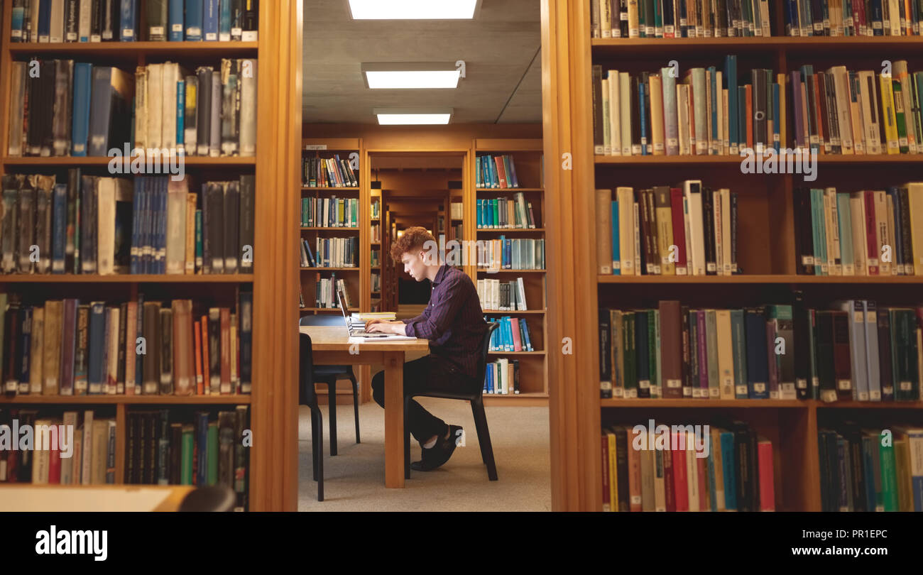 Male student laptop library hi-res stock photography and images - Alamy