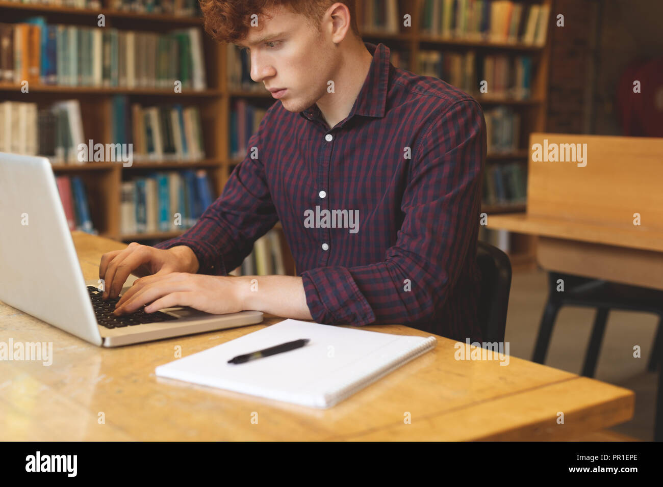 Male student laptop library hi-res stock photography and images - Alamy