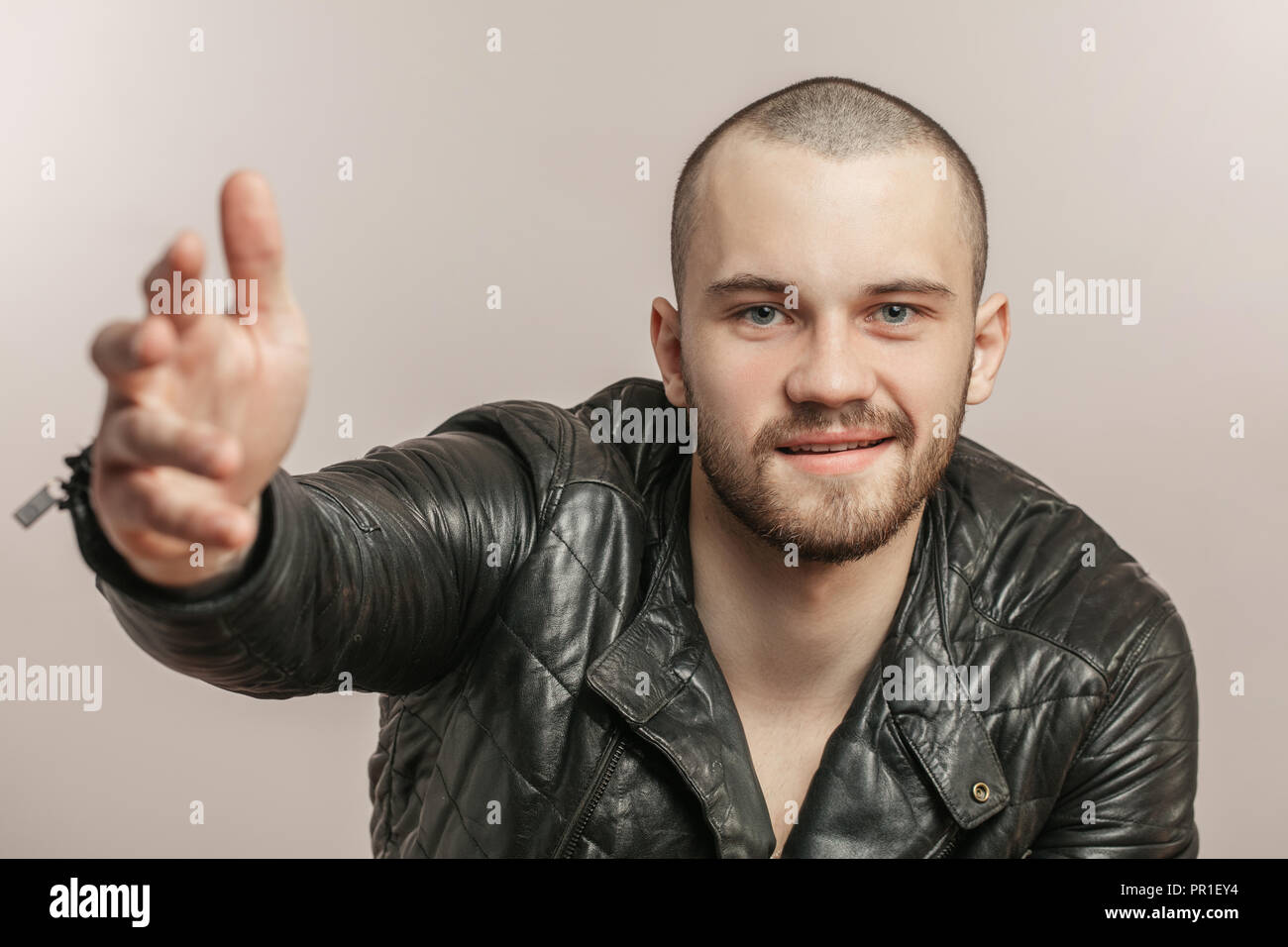 Inviting gesture young man hi-res stock photography and images - Alamy