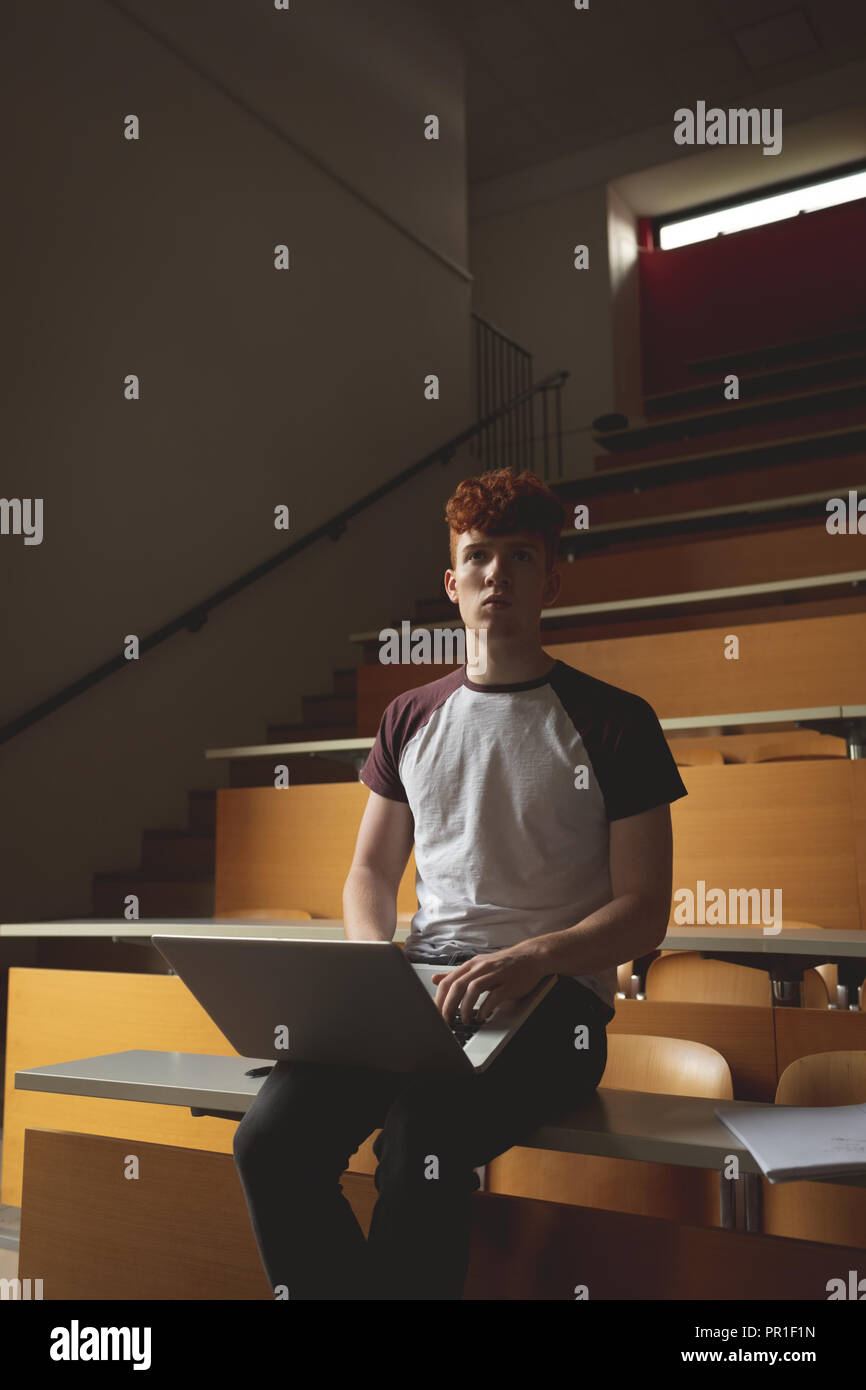 College student using laptop in classroom Stock Photo - Alamy