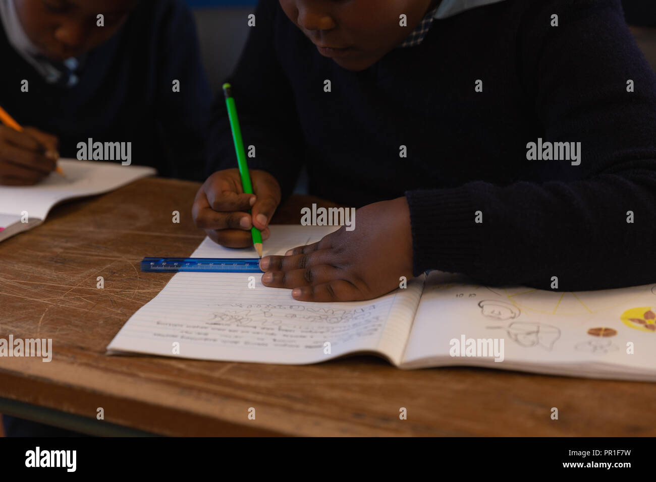 Schoolkids studying in the classroom Stock Photo - Alamy