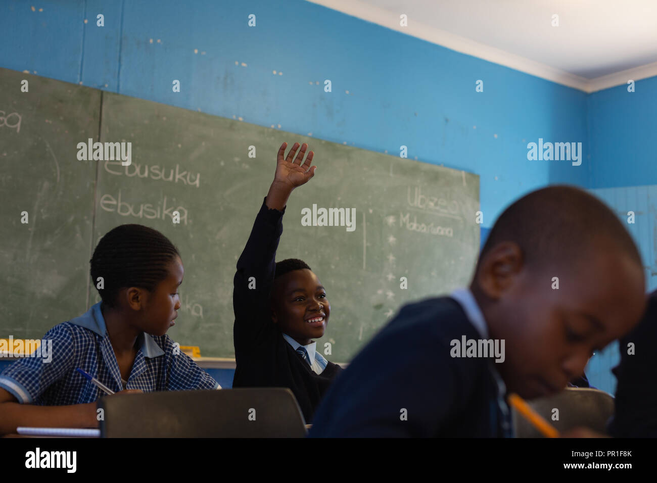 Schoolkids studying in the classroom Stock Photo - Alamy