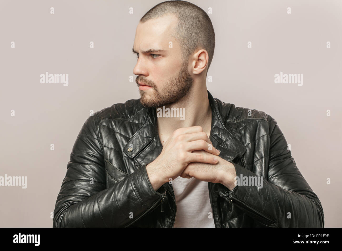 nervous man holding his hands and looking aside Stock Photo - Alamy