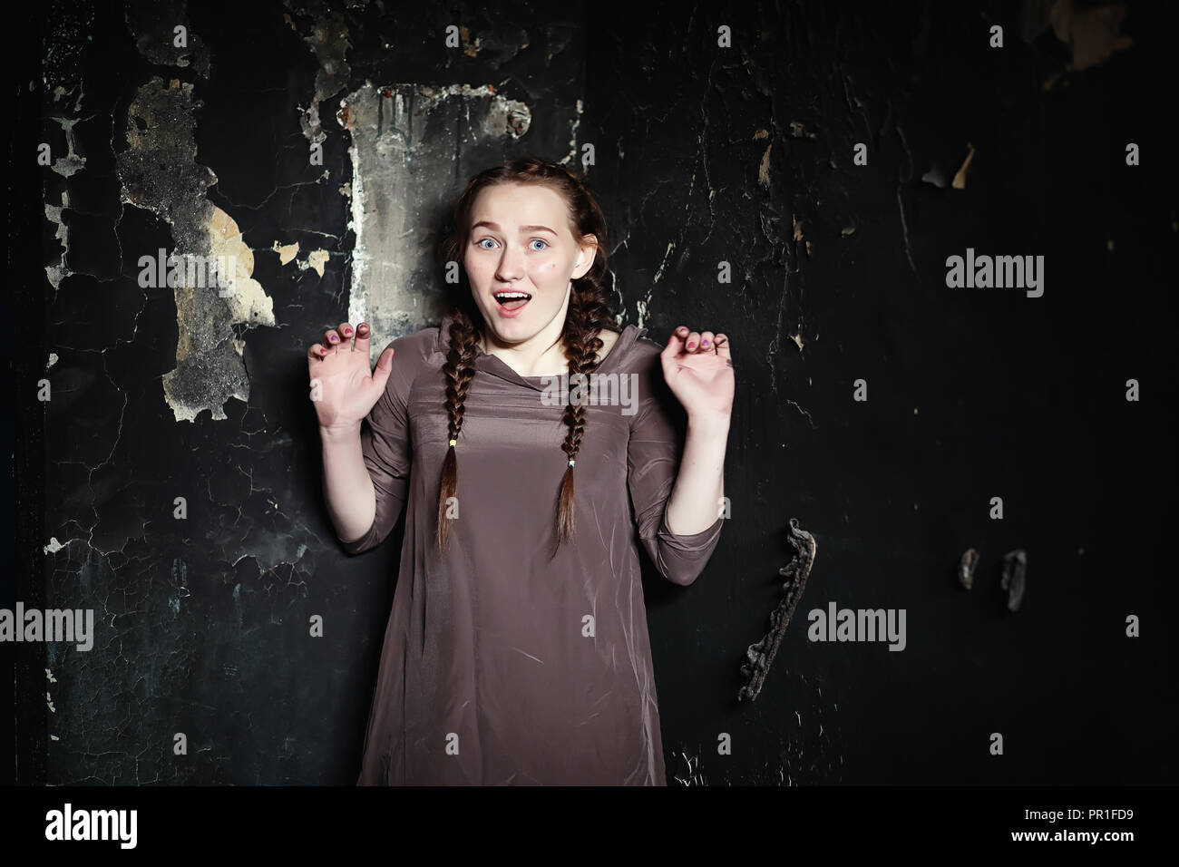 portrait of a frightened young pretty girl Stock Photo - Alamy