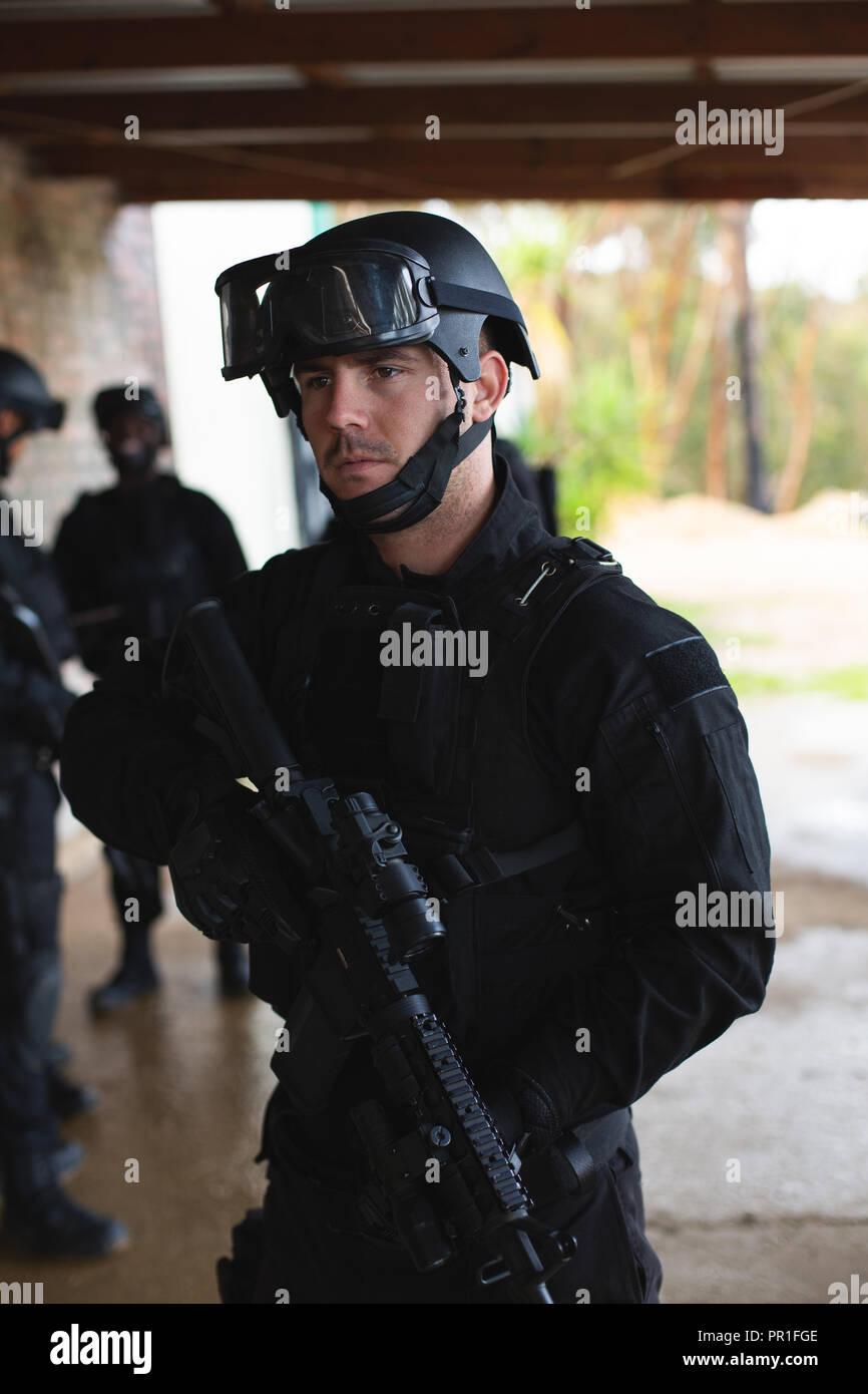 Military solider standing with rifle during military training Stock ...