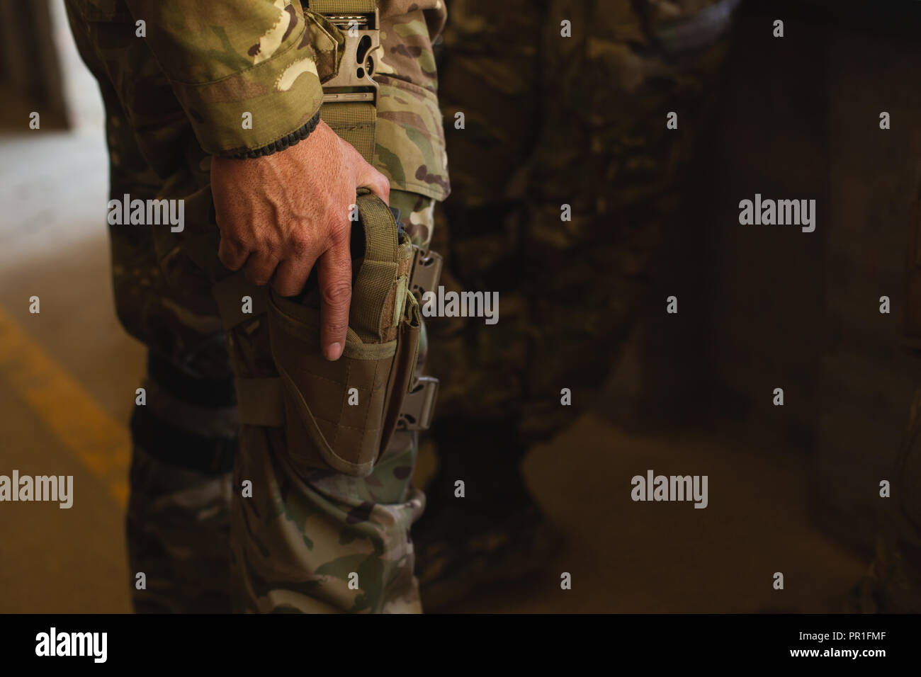 Military soldier standing with pistol during military training Stock ...