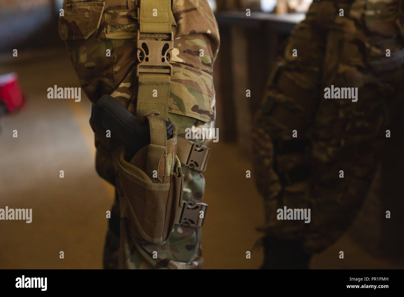 Military soldier standing with pistol during military training Stock ...