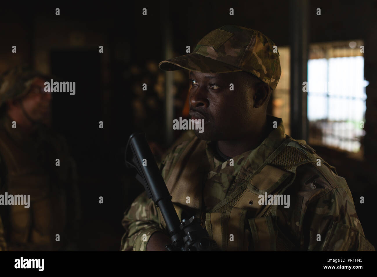 Army soldier standing holding weaponry uniform security hi-res stock photography and images - Alamy