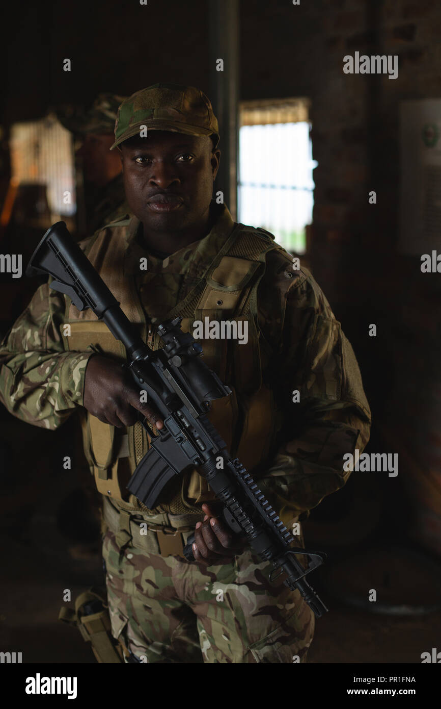 Military soldier standing with rifle during military training Stock ...