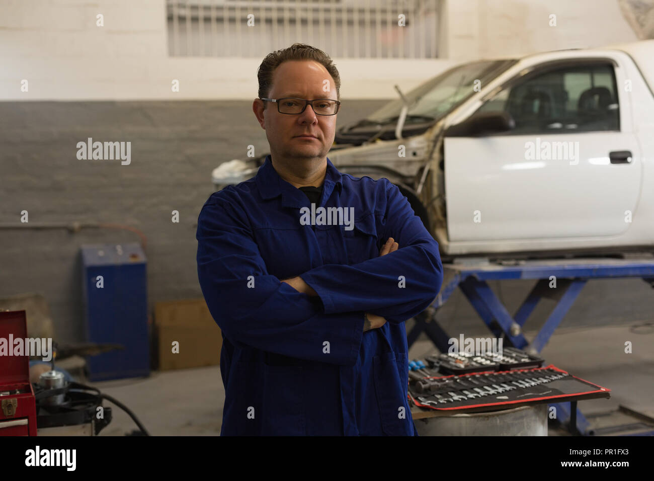 Standing looking automobile uniform hi-res stock photography and images ...