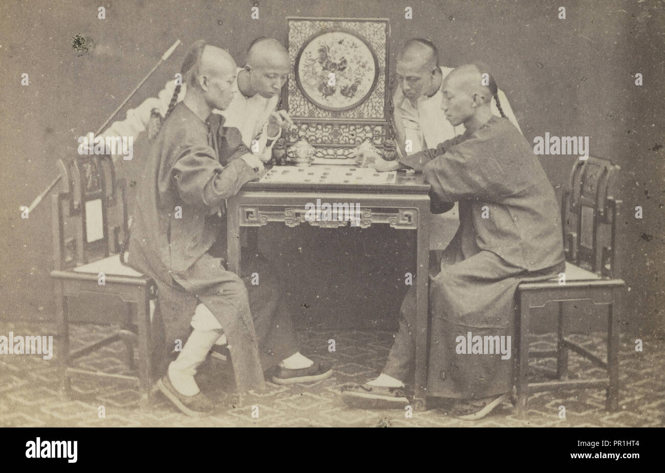 Chinese men playing checkers; recto, collection of photographs of China ...
