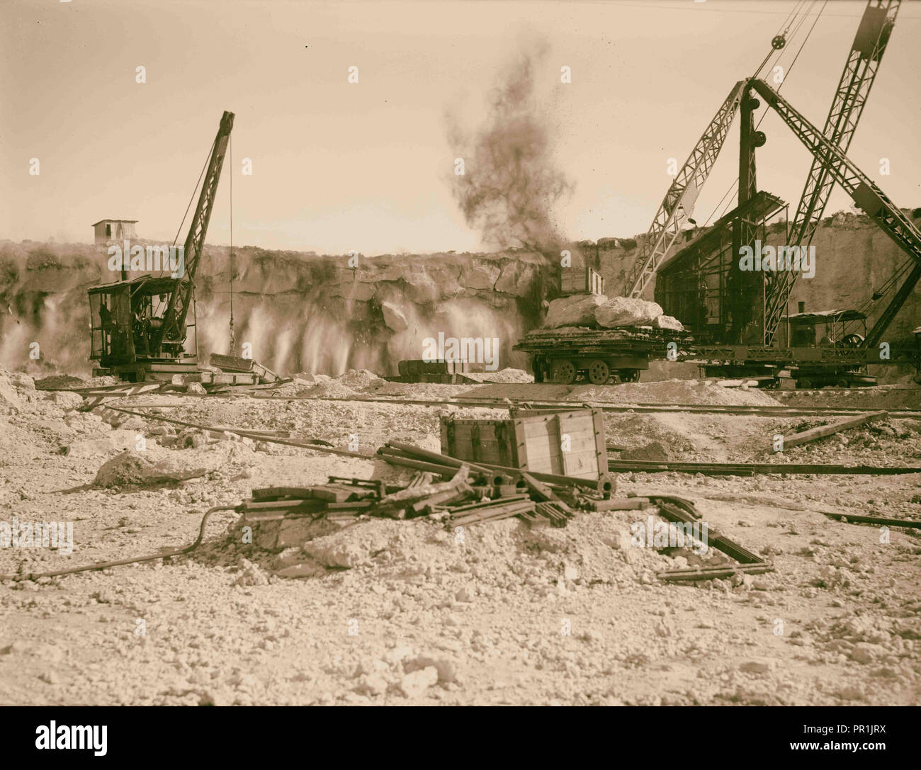 Construction of the Haifa Harbor. The Athlit quarries. Exploding of a ...