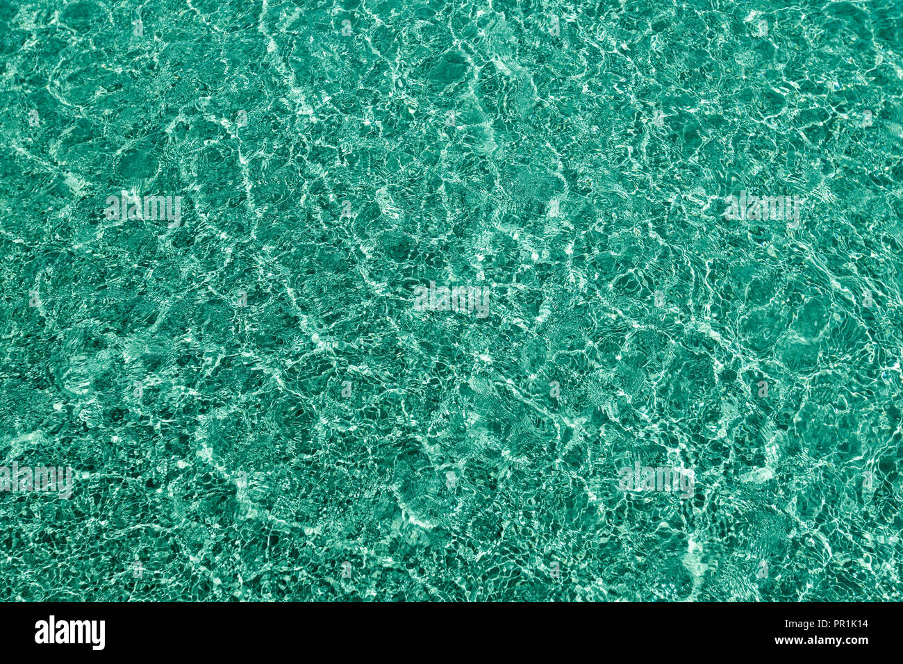 crystal clear sea water from above with sun reflections Stock Photo - Alamy