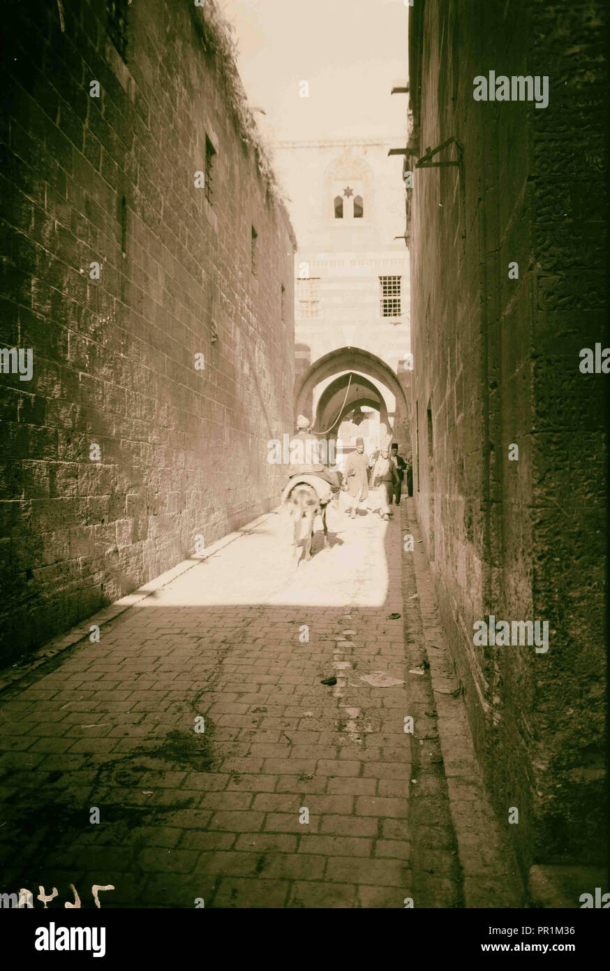 Aleppo. A narrow street in the old quarter; [Another view of a narrow ...