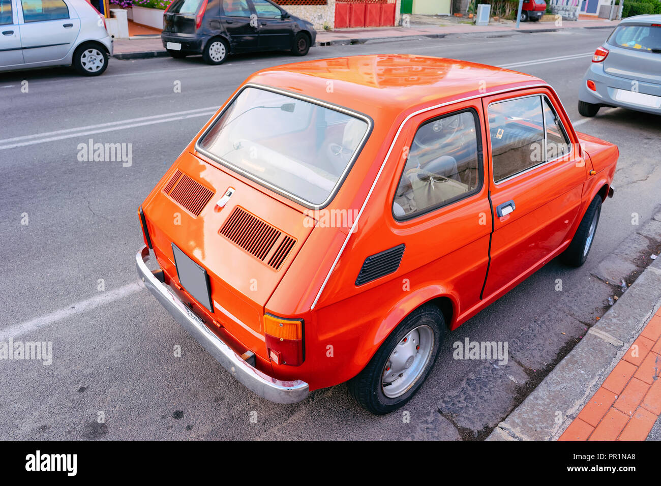 Red old car in the road in Santa Teresa di Riva at Messina, Sicily ...
