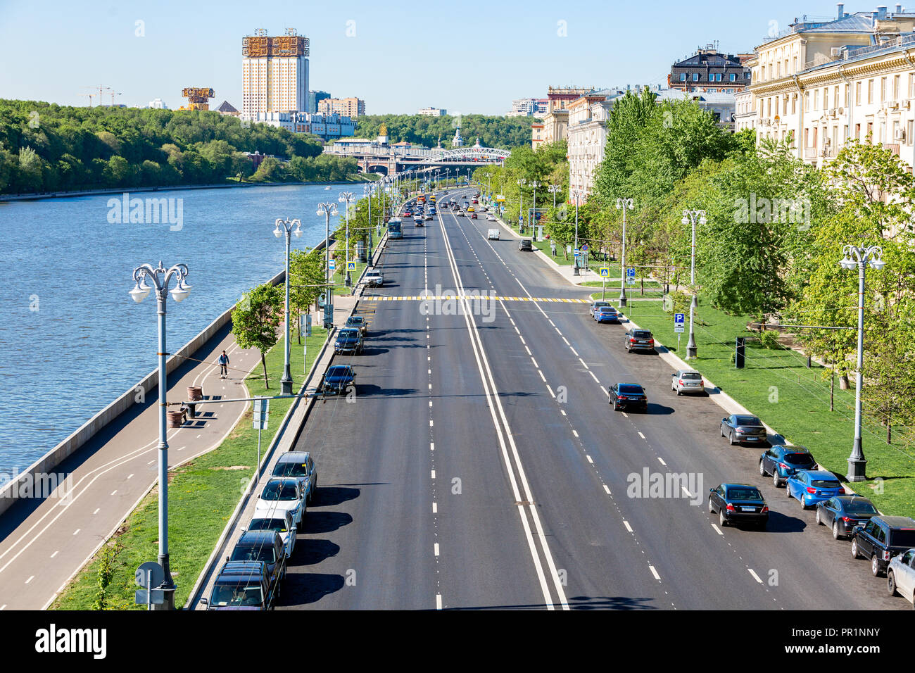 Cityscape with river and embankment in the big city Stock Photo - Alamy