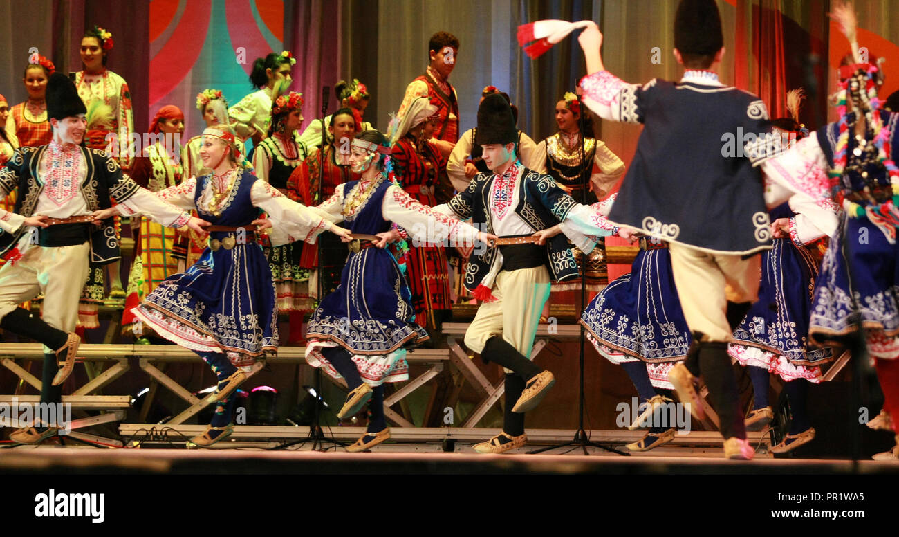 People in traditional folklore costumes perform folk dance bulgarian ...