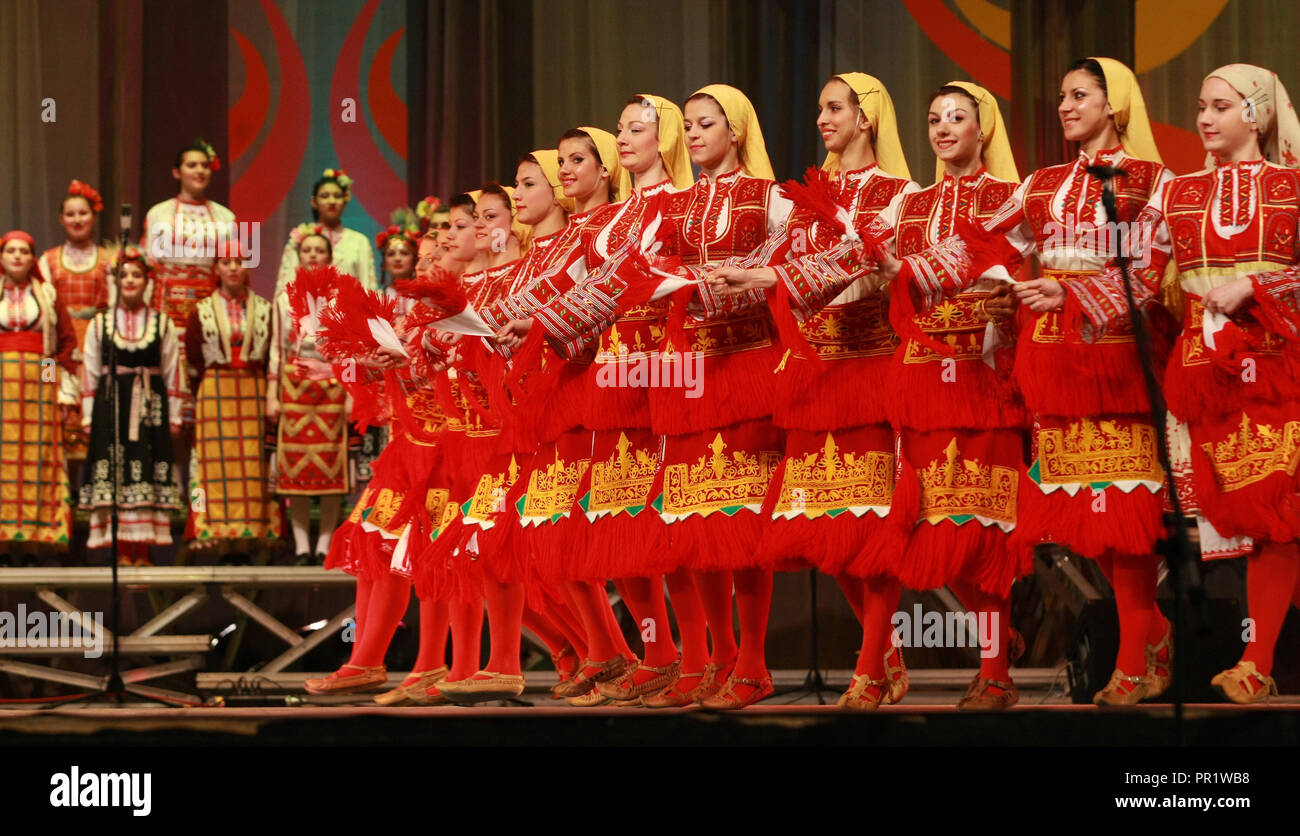 People in traditional folklore costumes perform folk dance bulgarian ...