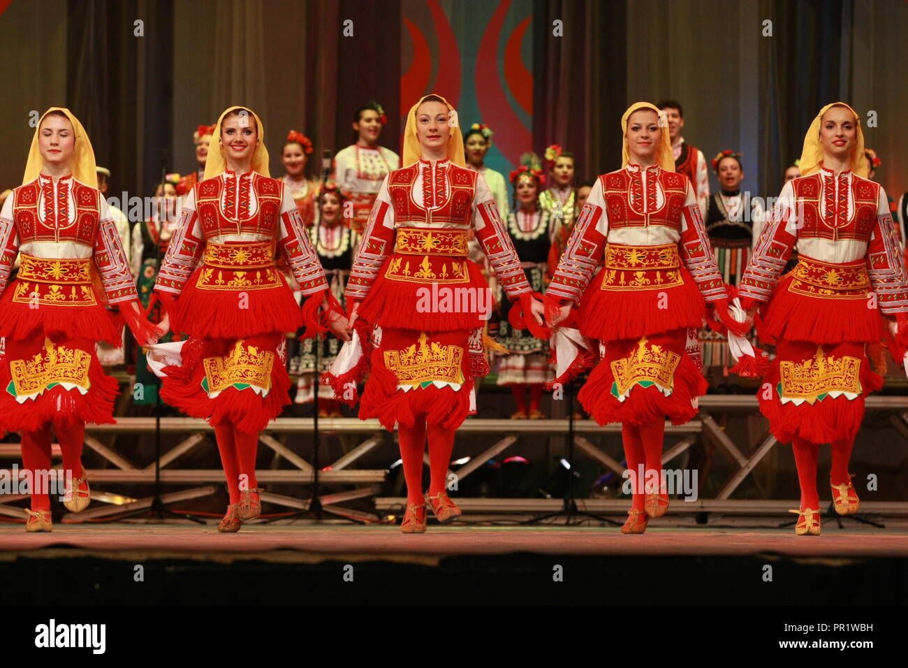 People in traditional folklore costumes perform folk dance bulgarian ...