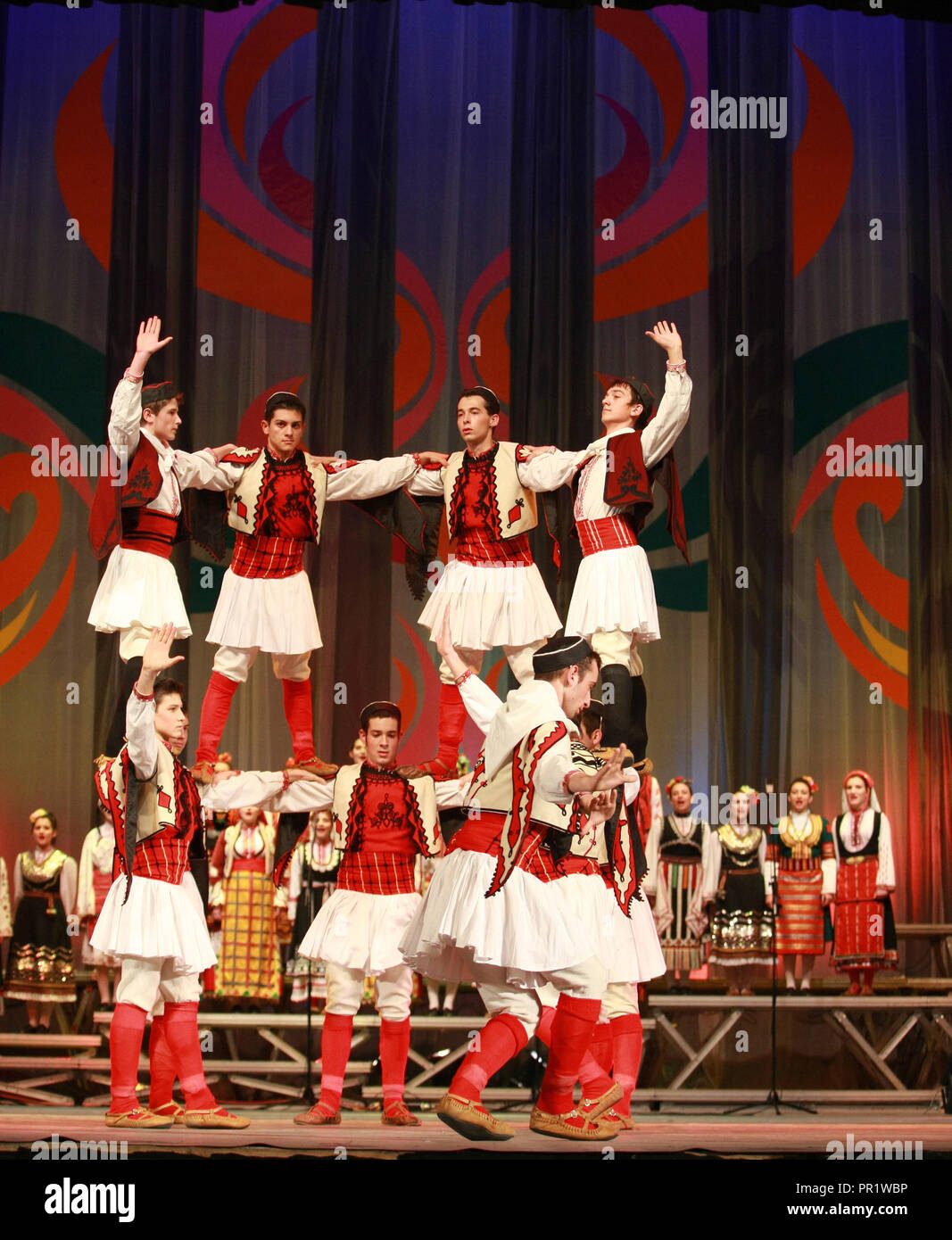 People in traditional folklore costumes perform folk dance bulgarian ...