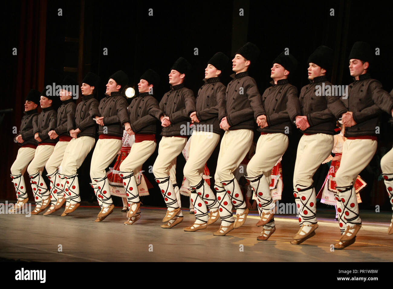 People in traditional folklore costumes perform folk dance bulgarian ...