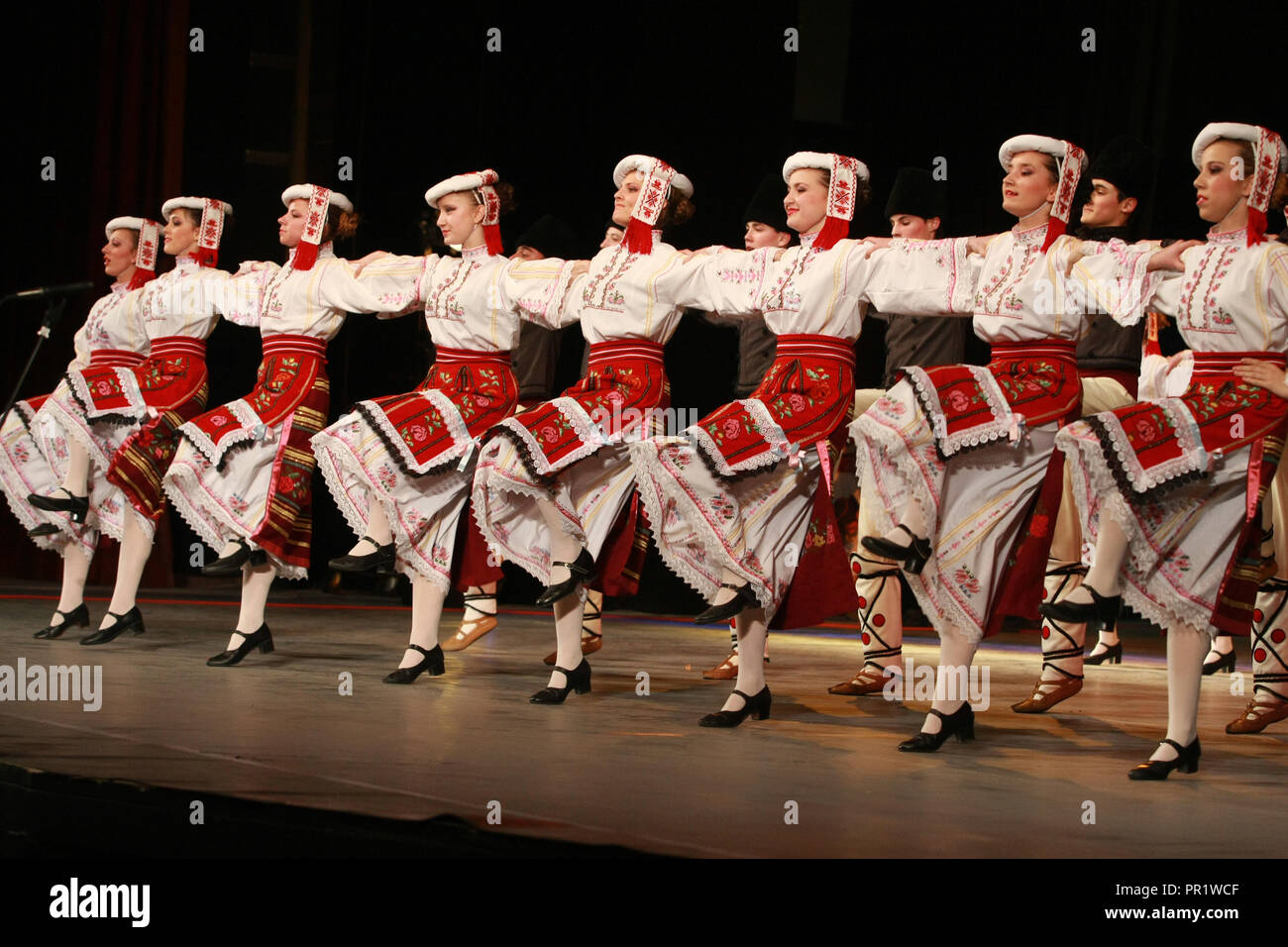 People in traditional folklore costumes perform folk dance bulgarian ...