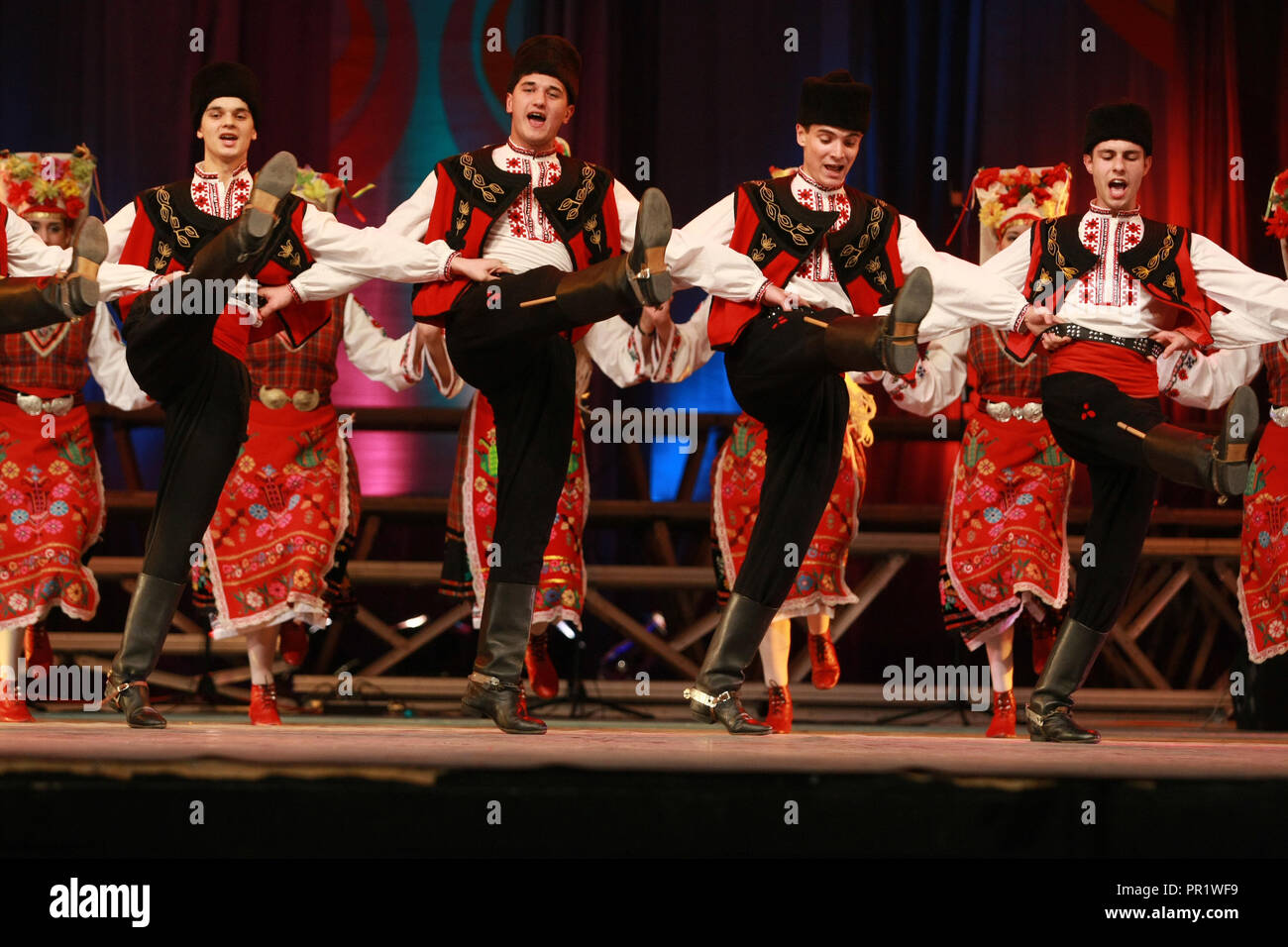People in traditional folklore costumes perform folk dance bulgarian ...