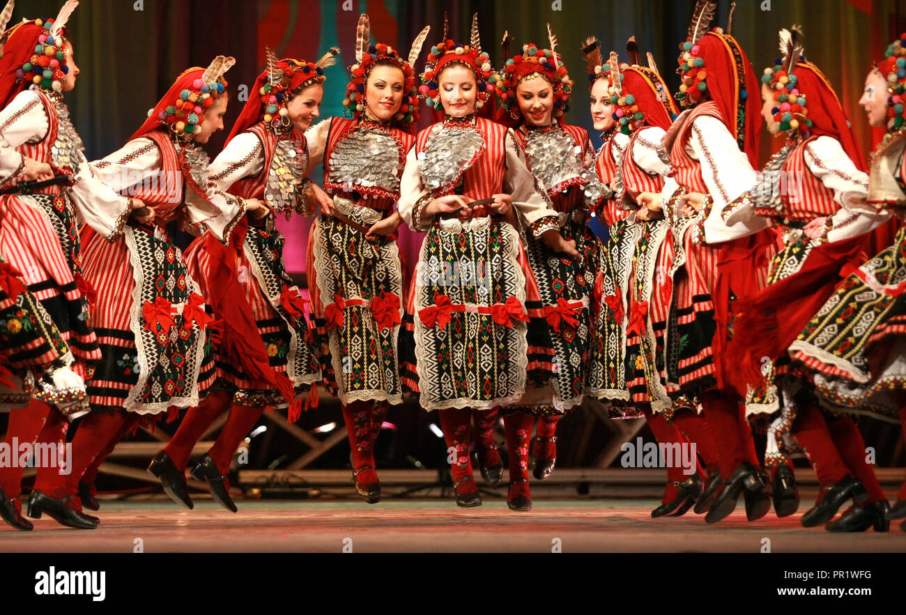 People in traditional folklore costumes perform folk dance bulgarian ...