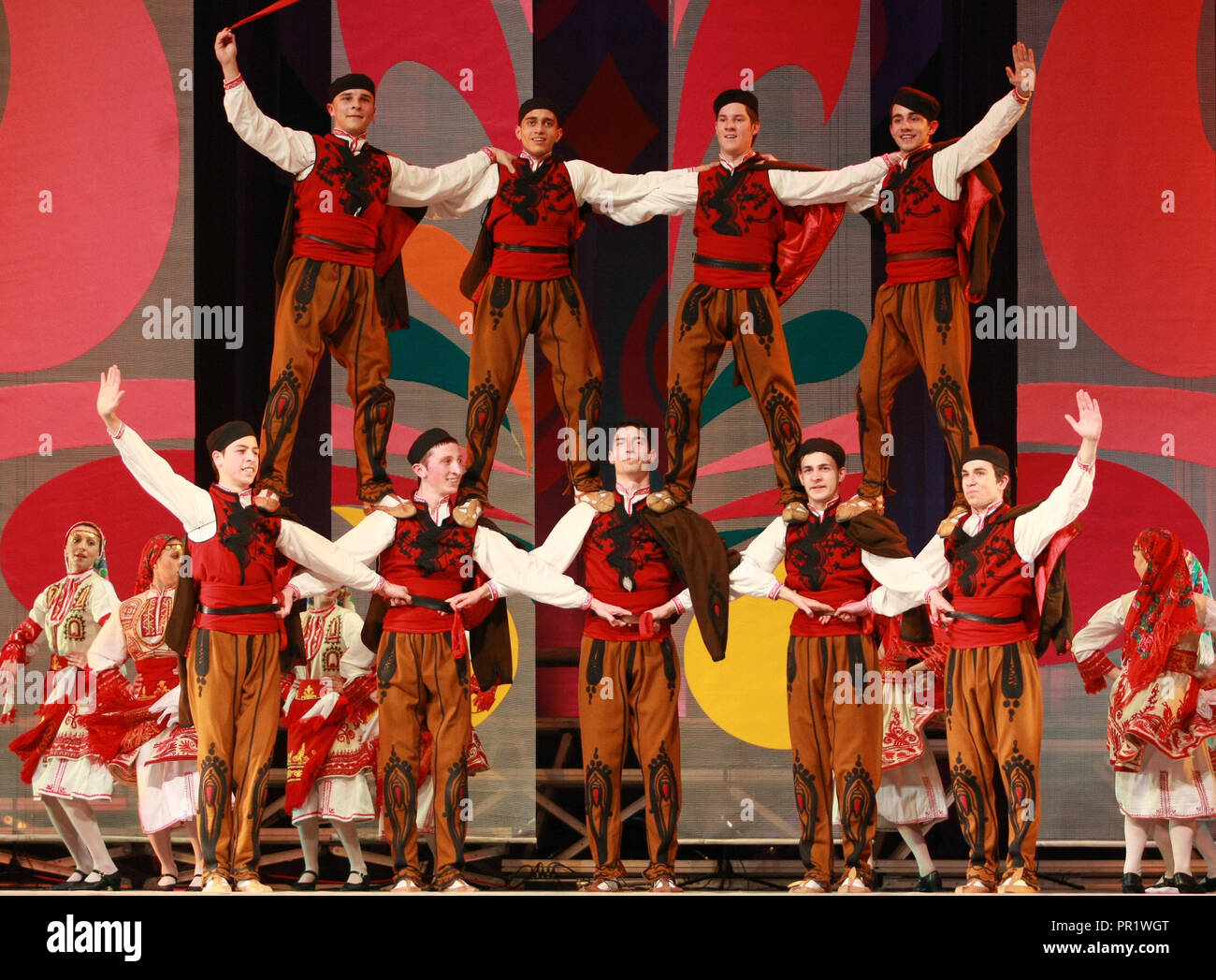 People in traditional folklore costumes perform folk dance bulgarian ...