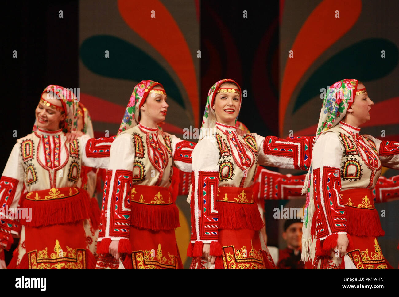 People in traditional folklore costumes perform folk dance bulgarian ...