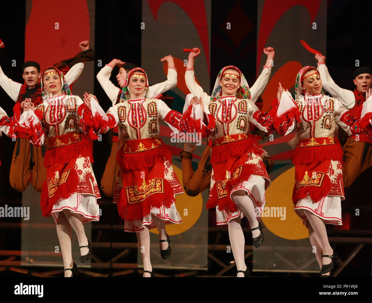 People in traditional folklore costumes perform folk dance bulgarian ...