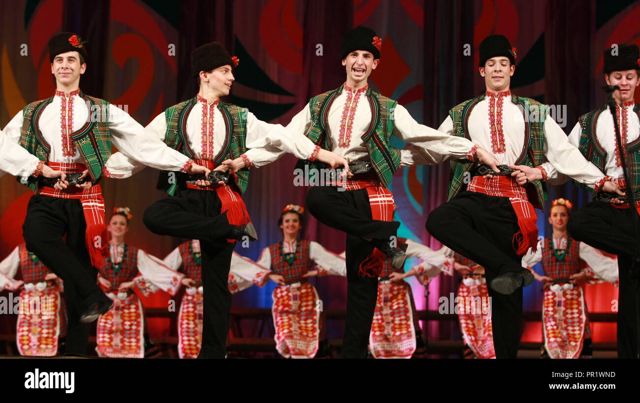 People in traditional folklore costumes perform folk dance bulgarian ...