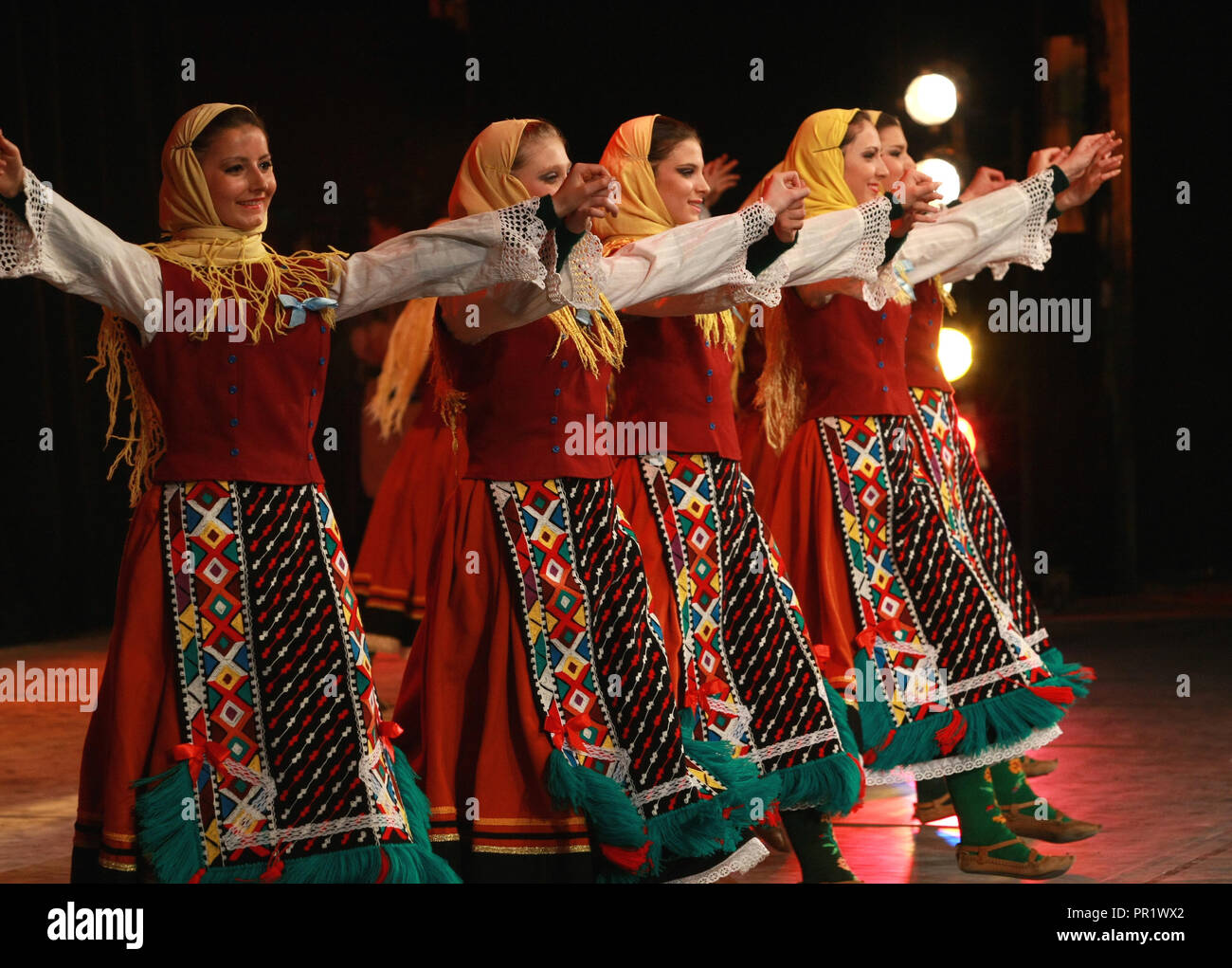 People in traditional folklore costumes perform folk dance bulgarian ...