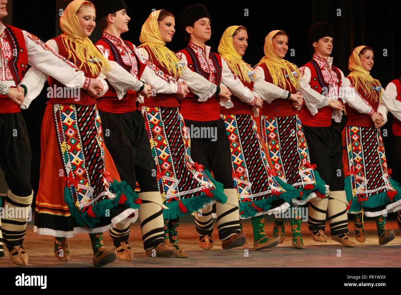 People in traditional folklore costumes perform folk dance bulgarian ...