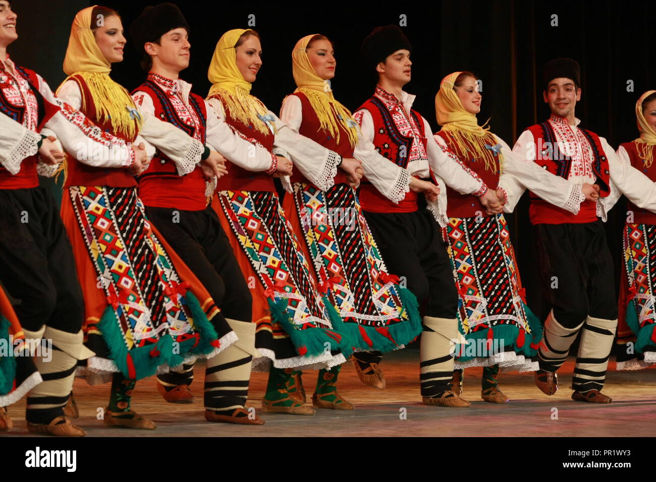 People in traditional folklore costumes perform folk dance bulgarian ...