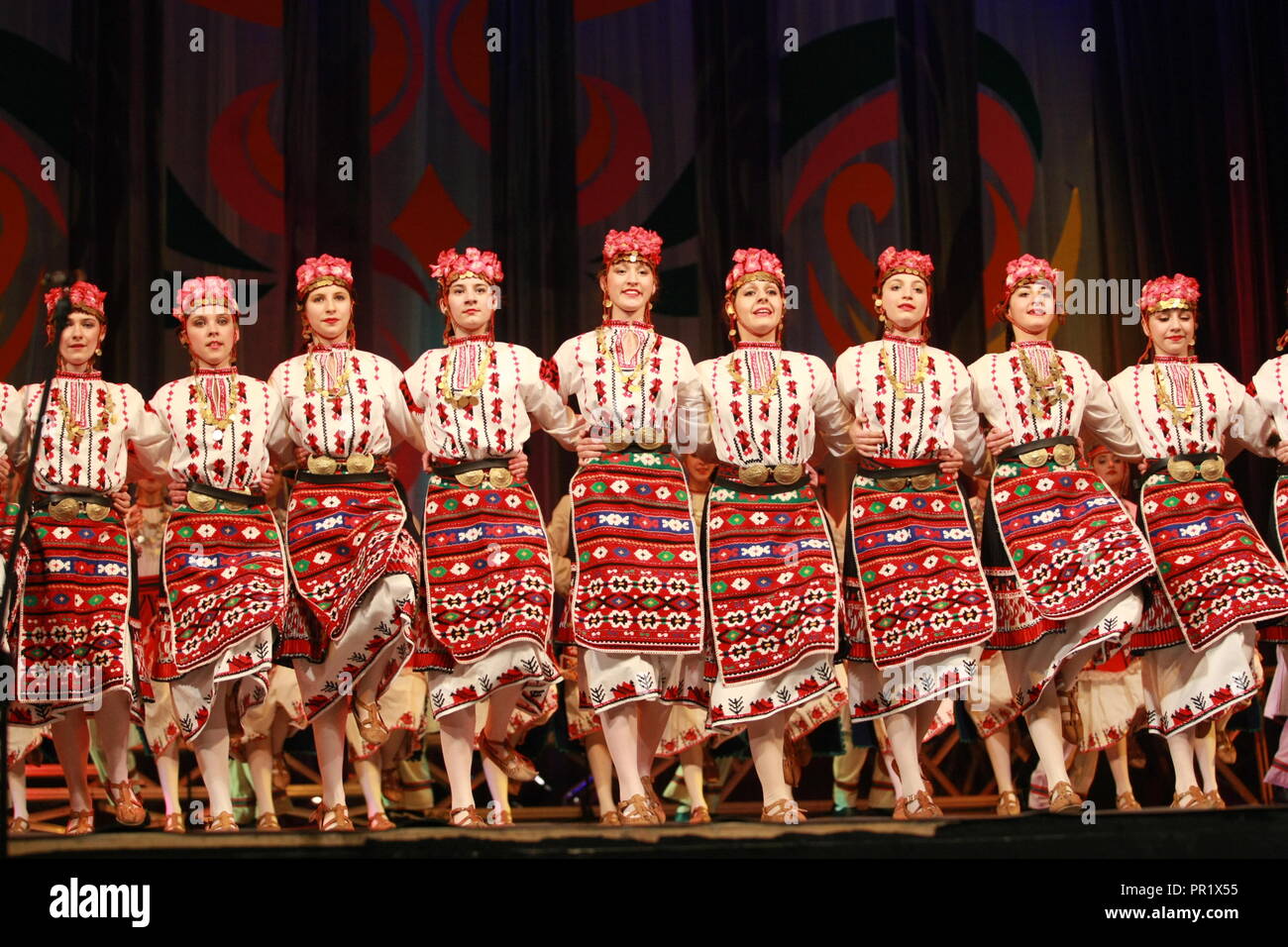 People in traditional folklore costumes perform folk dance bulgarian ...
