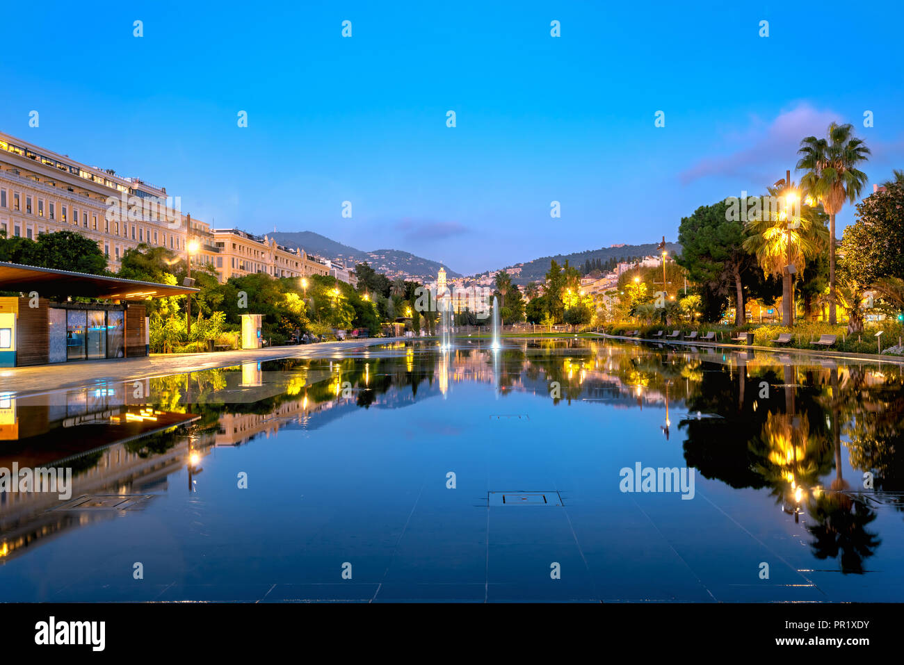 Night view of fountain at Place Massena at downtown Nice. French ...