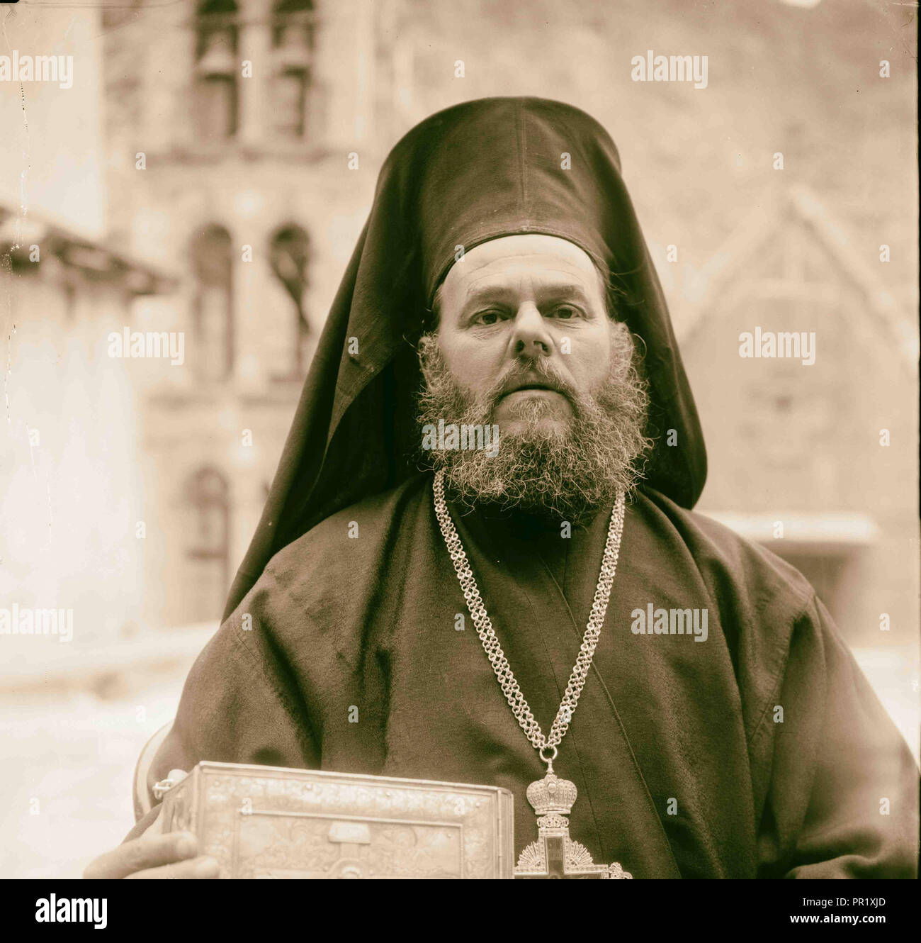 Greek Orthodox priest at St. Catherine's Monastery in the Sinai holding ...