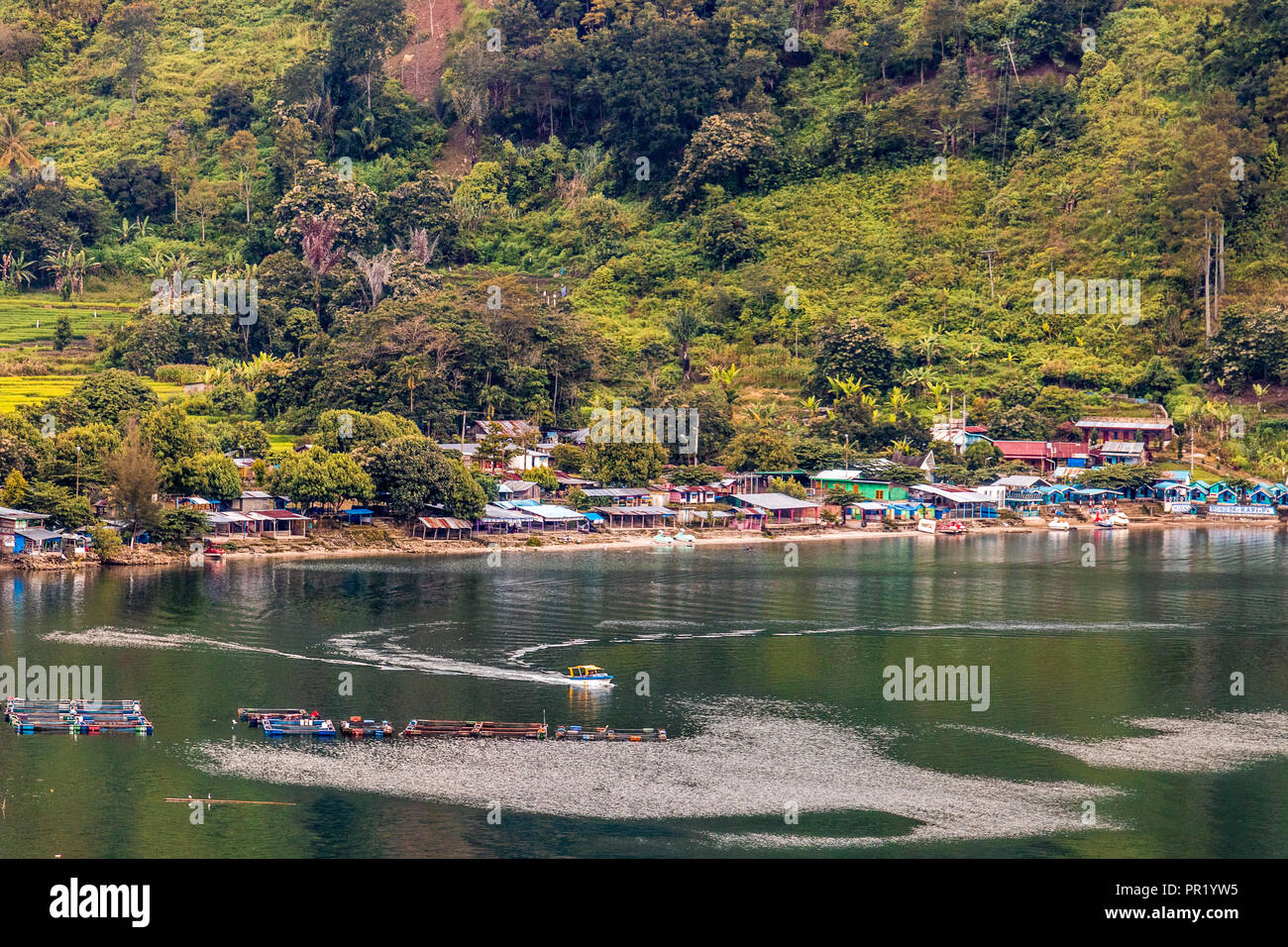 Parapat coastal town on banks of Lake Toba in the Uluan Peninsula ...