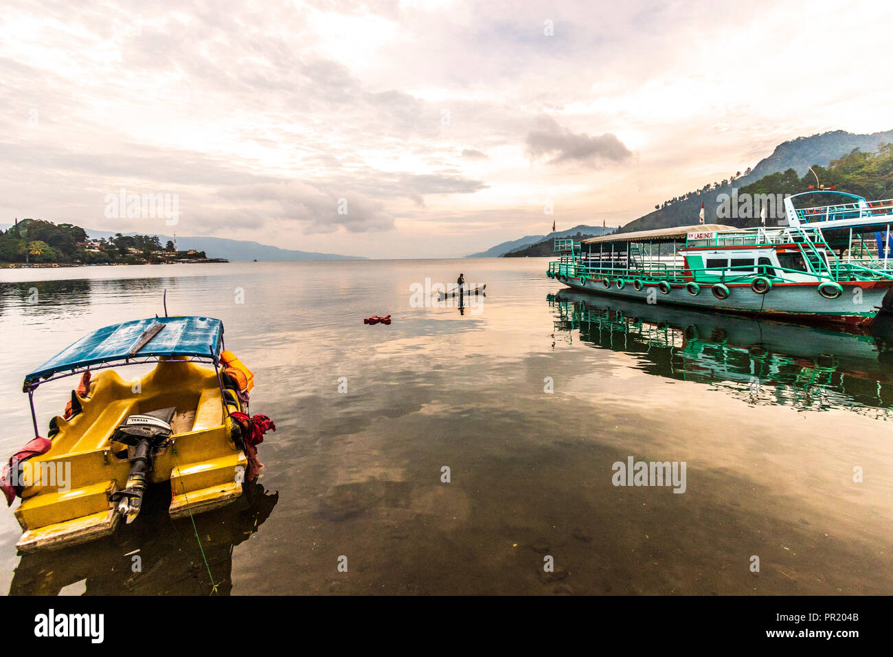 Parapat coastal town on banks of Lake Toba in the Uluan Peninsula ...