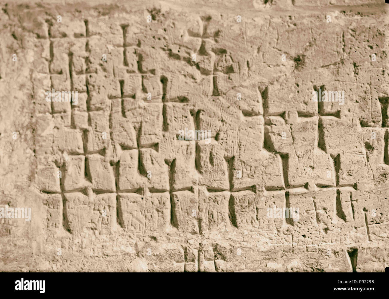 Repair work in Church of the Holy Sepulchre Details of crosses cut in ...