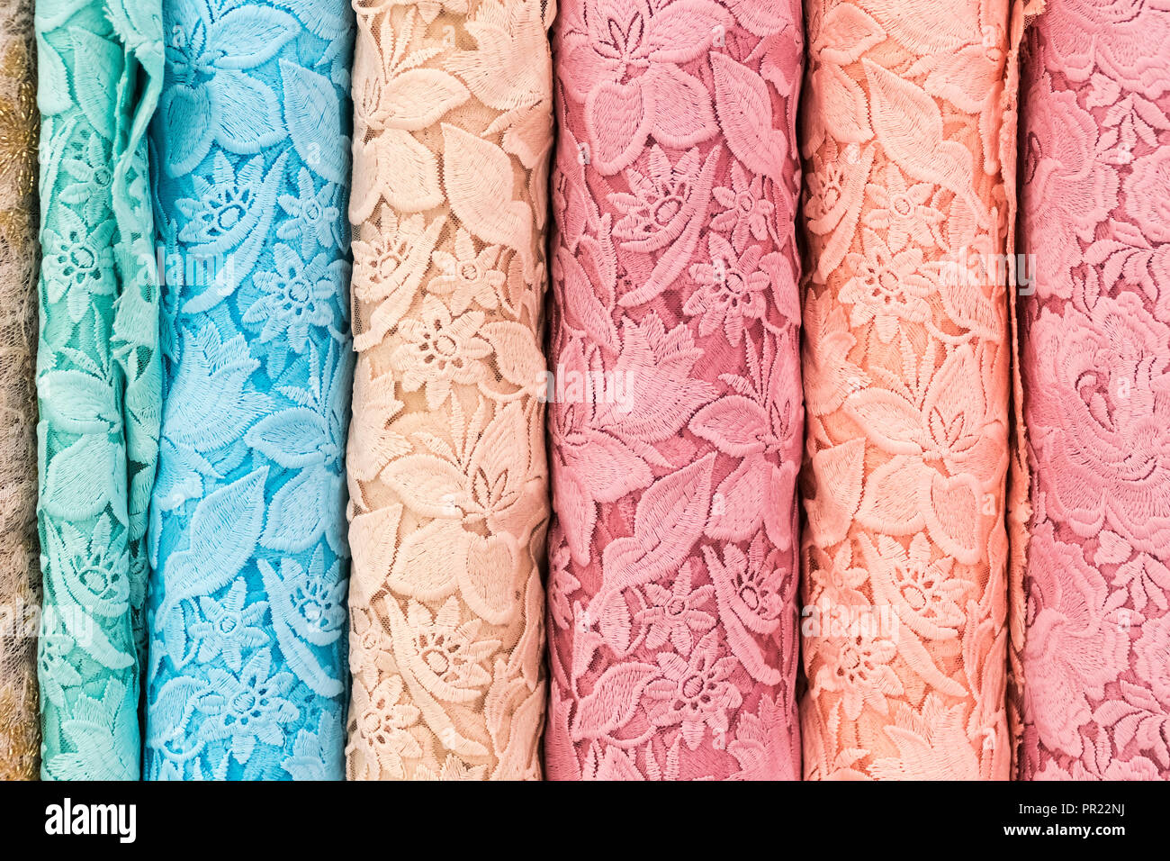 Samples of fabric - lace of different colors on the display case Stock ...