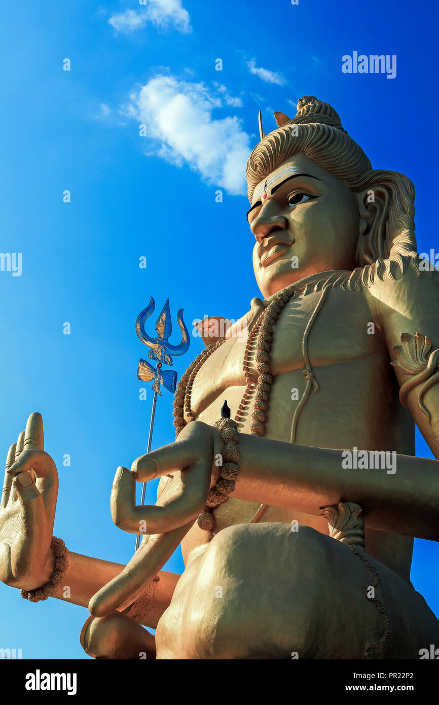 Statue of the Hindu god Shiva with trident spear (trisula, trishula) at ...