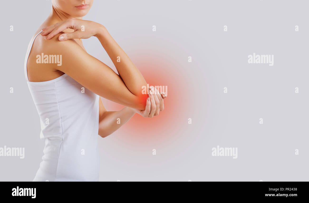 Pain, injury in the elbow joint Stock Photo - Alamy