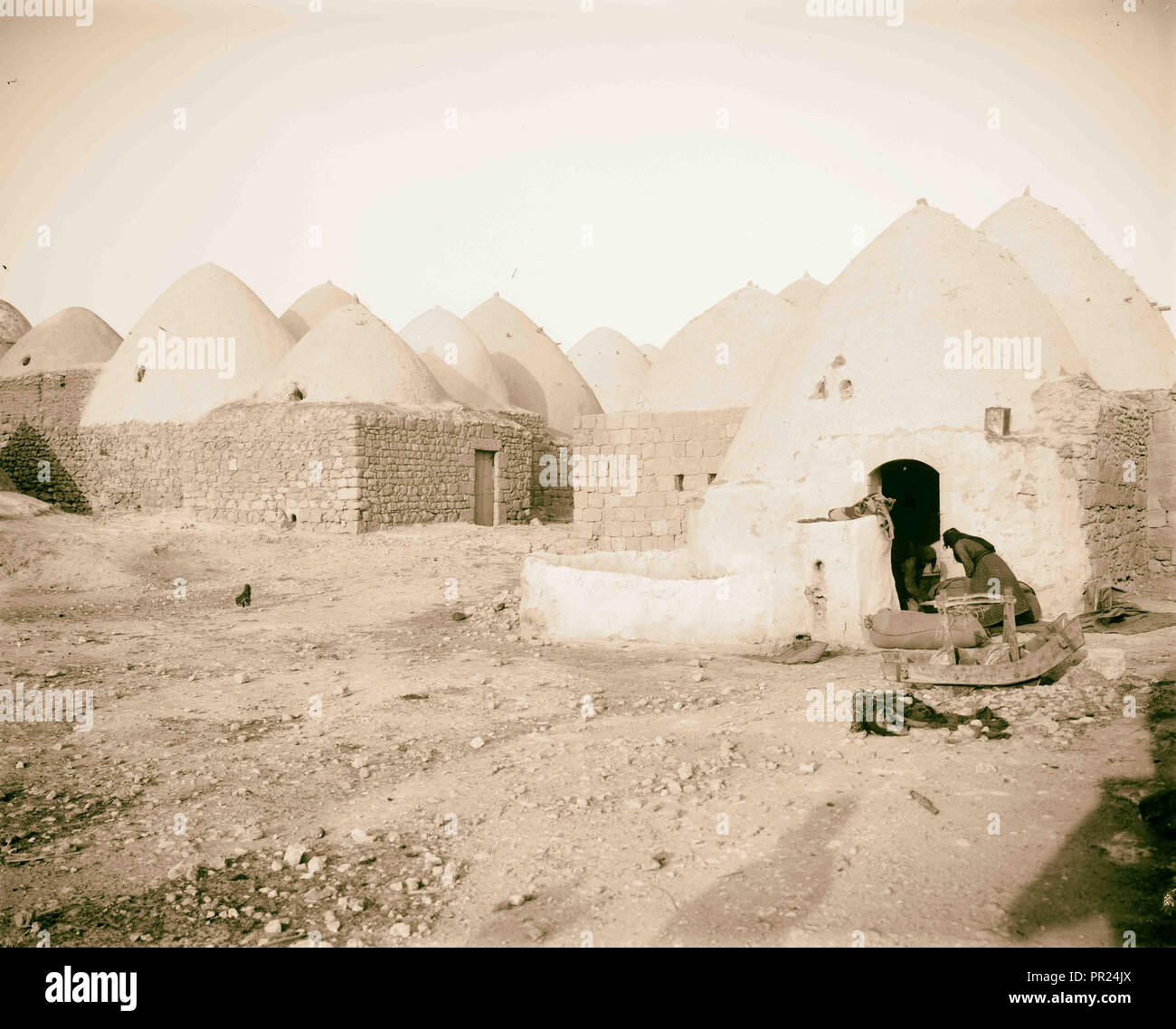 Bee-hive homes, Moselmeih, Syria. Photograph shows beehive houses near ...