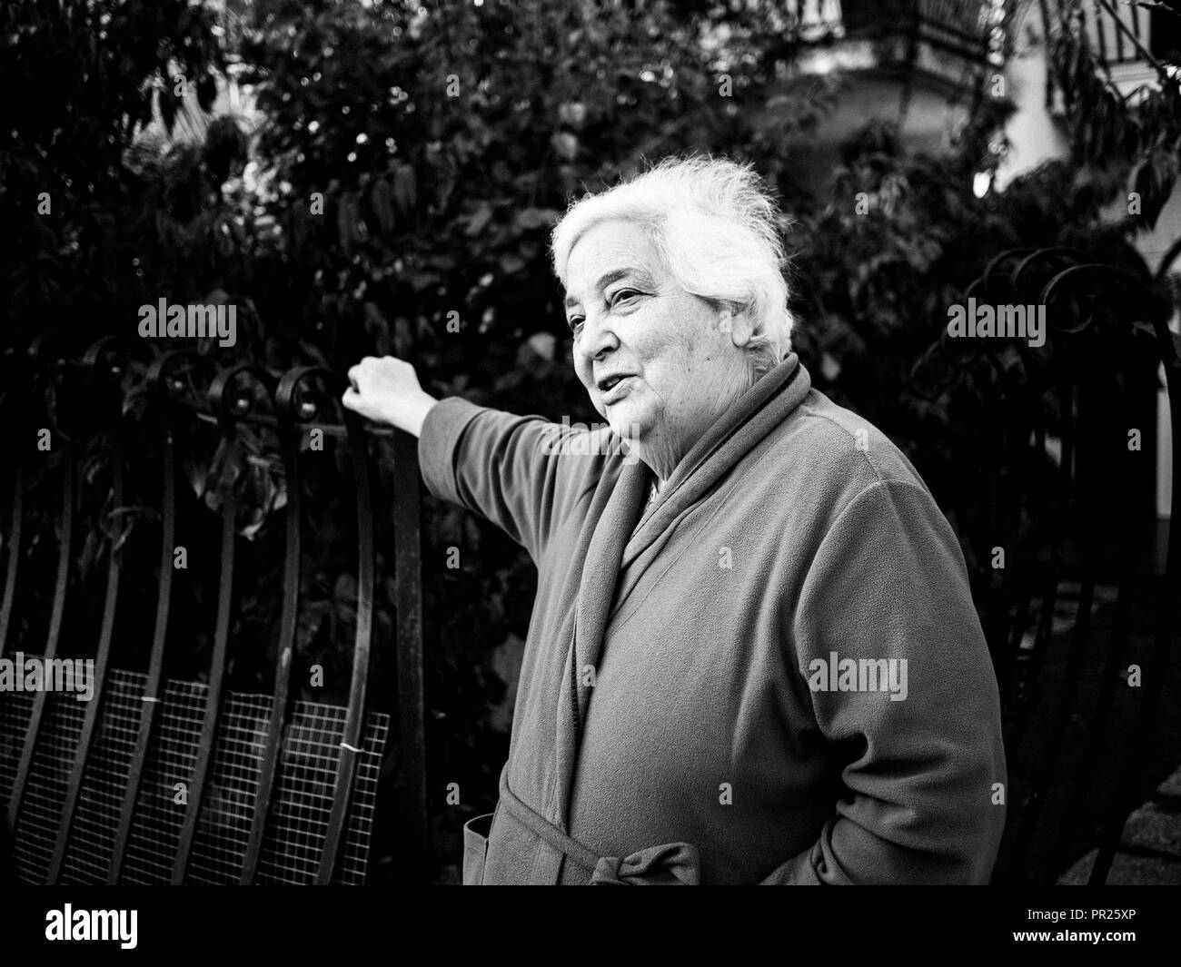 Older mature woman standing back Black and White Stock Photos & Images ...