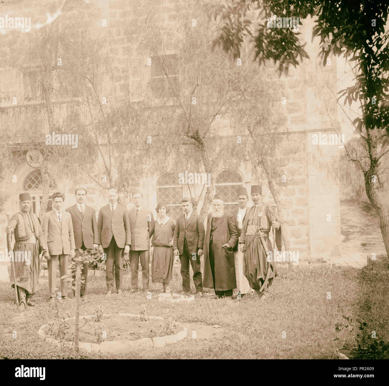 Group in front of consulate. Oscar S. Heizer, American Consul, fourth ...