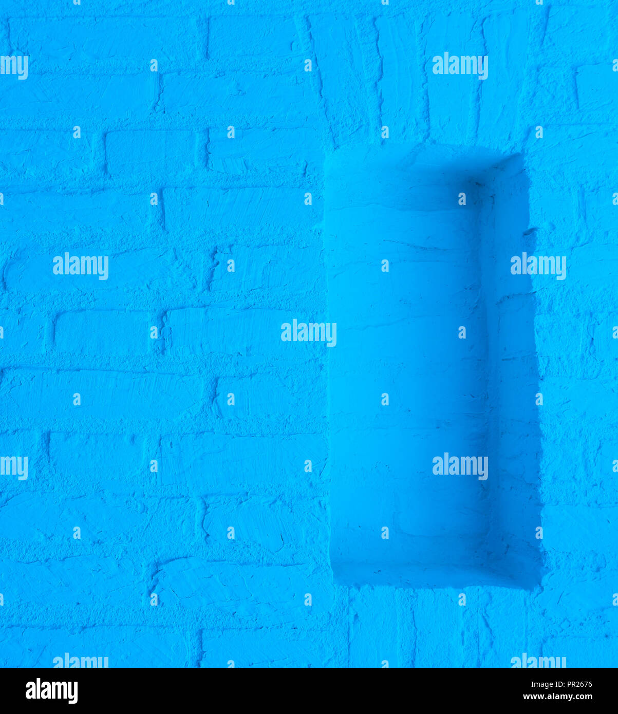 Modern neon blue colored brick wall texture background with empty ...