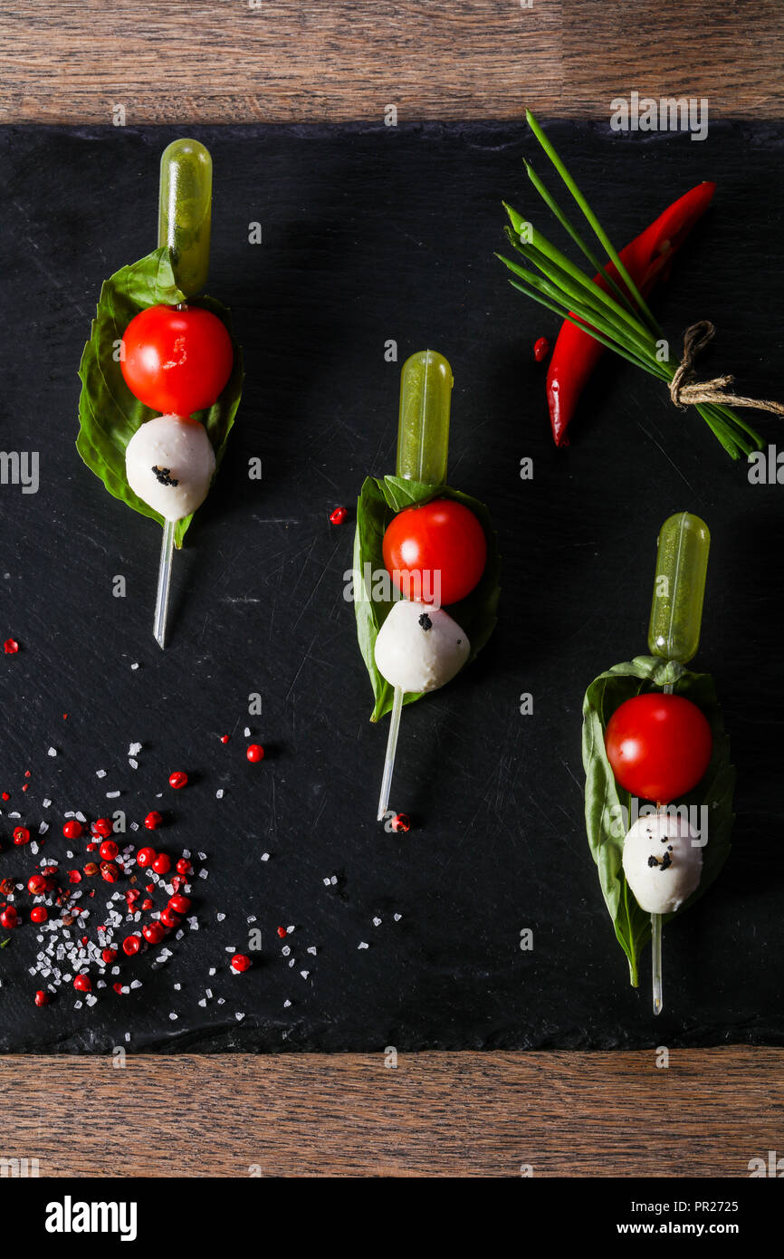 Canape caprese with olive oil Stock Photo - Alamy